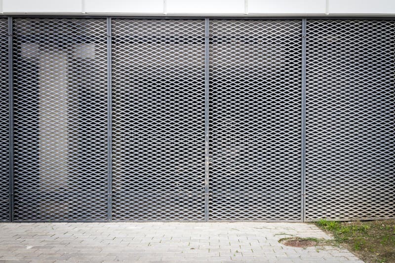 Iron Grid Wall and a Sidewalk Stock Photo - Image of street ...