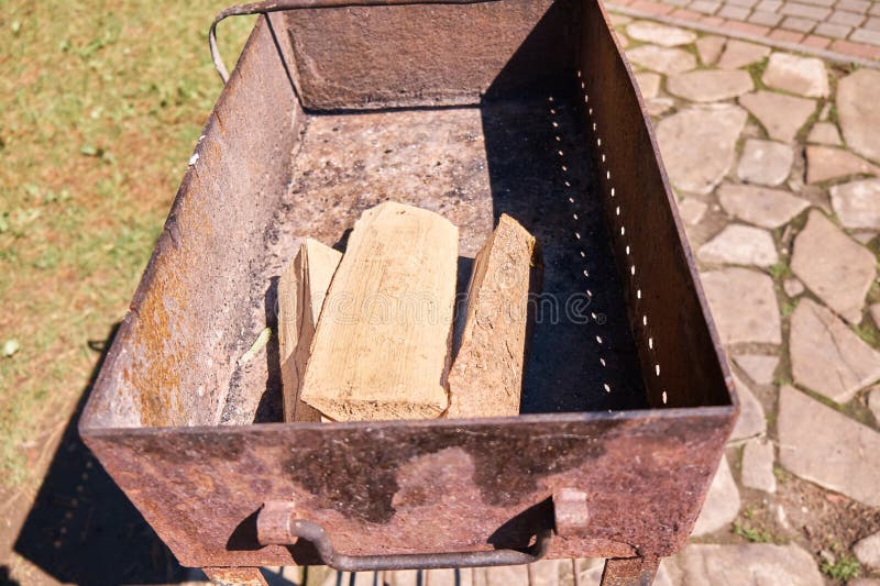 Iron Grill and Firewood for Barbeque Inside. Selective Focus Stock ...