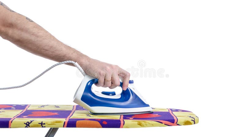 Iron in hand on iron board stock photo. Image of hold - 140500888