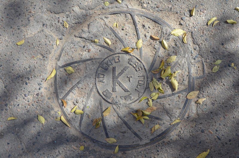 An iron hatch with k stock image. Image of macadam, loose - 128471503