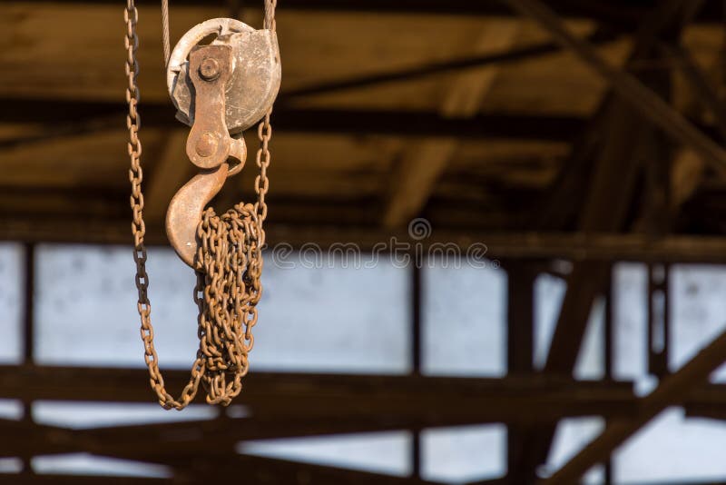 An Iron Hook on a Pulley and a Chain Stock Photo - Image of industrial ...
