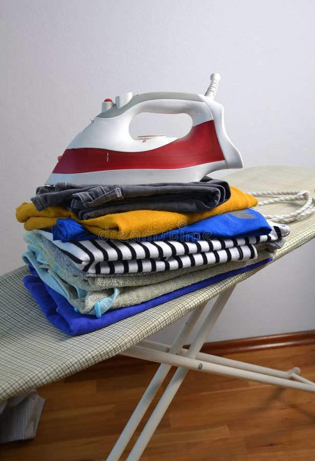 An Iron with Ironed Laundry Stock Image - Image of handle, home: 179206945