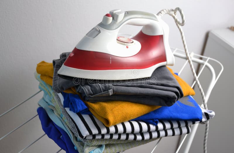 An Iron with Ironed Laundry Stock Image - Image of cloth, flatiron ...