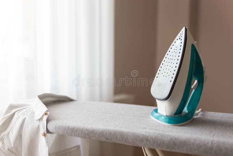Iron on an ironing board stock image. Image of fresh - 137399655