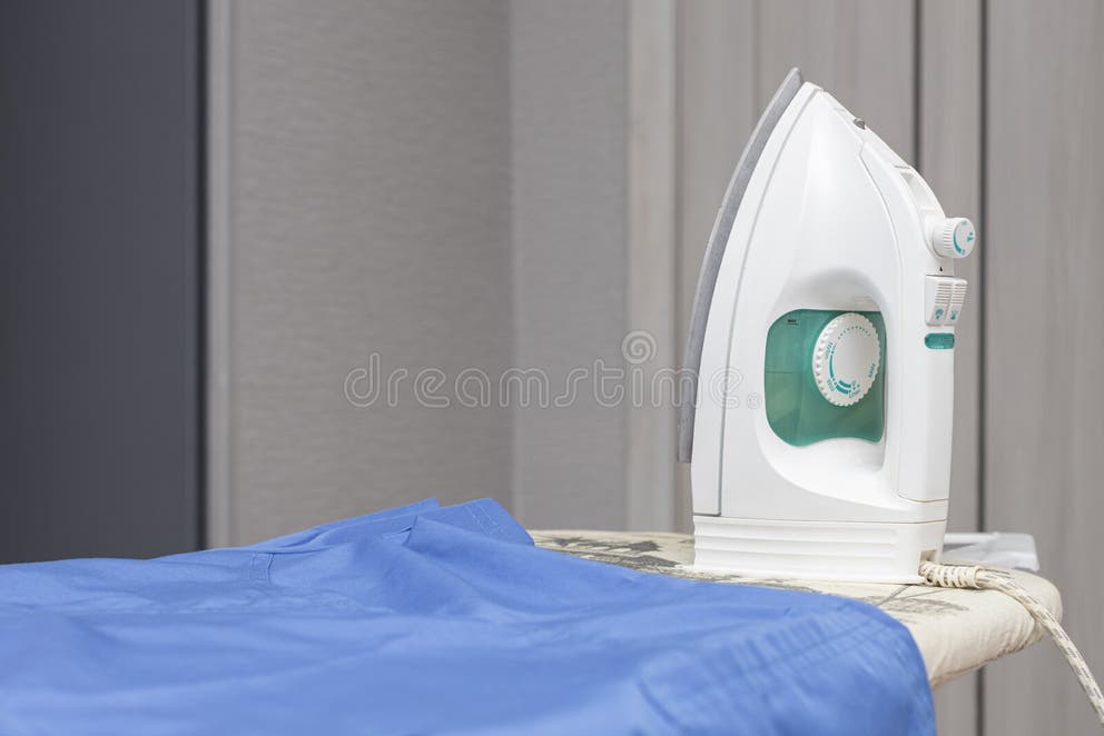 The Iron is on the Ironing Board Stock Image - Image of iron, switch ...