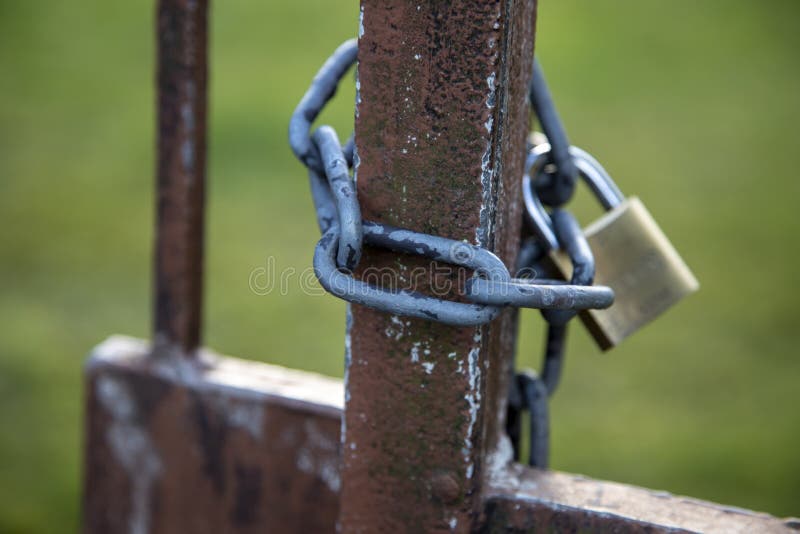 Iron Link Chain with Two Locks Lock a Rusty Iron Gate, Symbol for ...