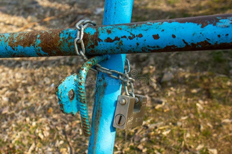 Iron Lock with Chain on the Blue Barrier Stock Photo - Image of ...
