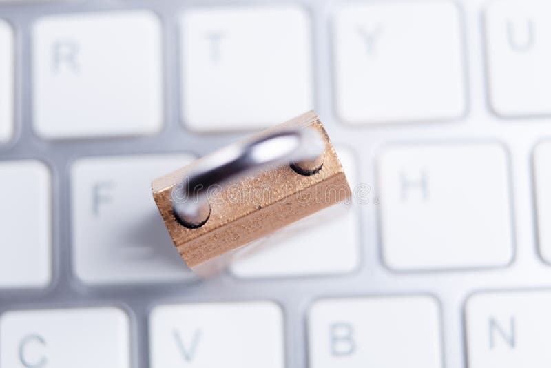 Iron lock on the keyboard stock photo. Image of safe - 234157364