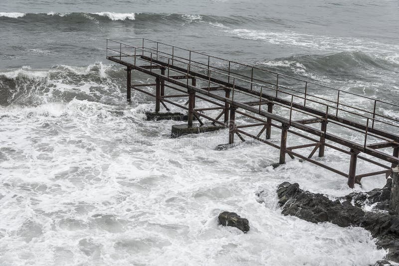 Iron pier at storm. stock image. Image of black, ocean - 72992505