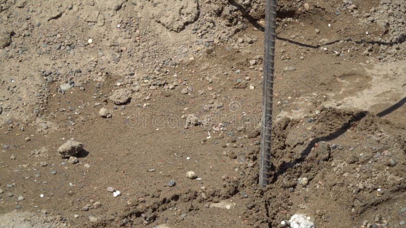 Iron Pins are Driven into the Ground. Concept of Building and Repairing ...