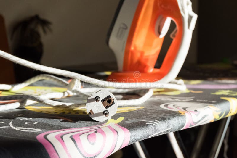 Iron Plug Against the Backdrop of the Iron in the House Stock Image ...