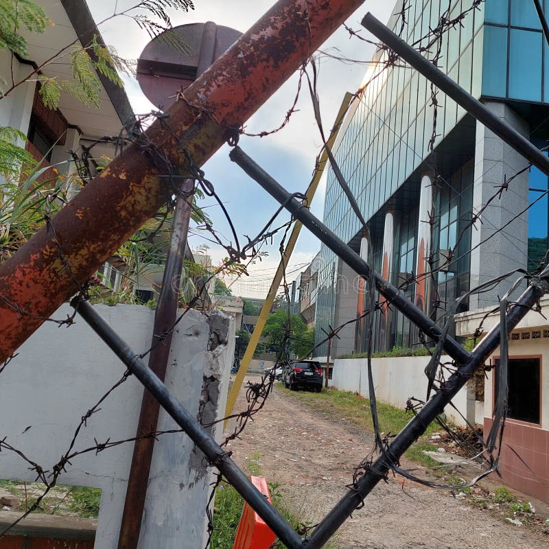 Iron Pole Entry Gate with Barbed Wire Installed Editorial Photo - Image ...