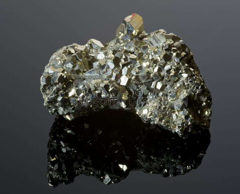 Iron Pyrites on a Black Reflective Surface Stock Image - Image of shiny ...
