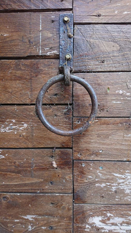 Iron Ring on a Wooden Door stock photo. Image of backgrounds - 232166056