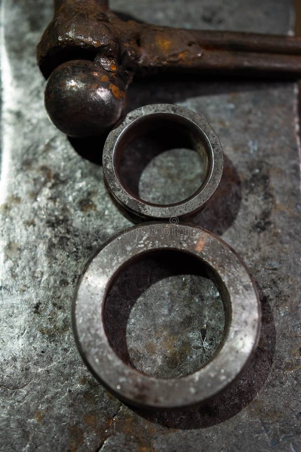 Iron Rings and Hammer on a Metal Surface Stock Photo - Image of circle ...