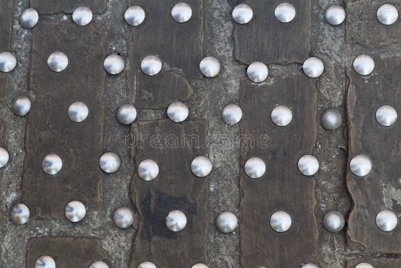 Iron Rivets on the Stone Cobbles Stock Photo - Image of shiny, pavement ...