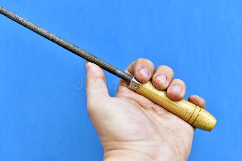 Iron Round File Wooden Handle Hand Blue Background Stock Photos - Free ...