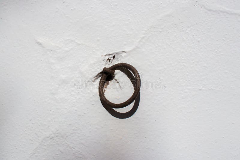 An Iron Rusty Ring is Suspended on a Wall. Stock Image - Image of white ...