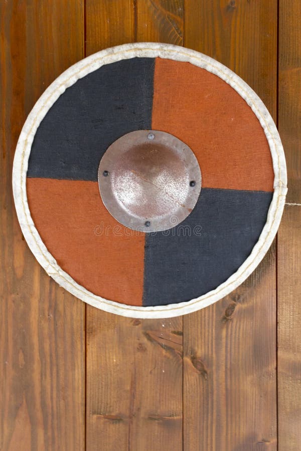 Iron shield on wooden wall stock photo. Image of medieval - 236044478