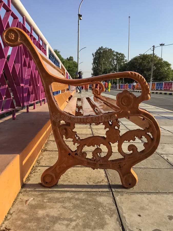 An Iron Sitting Bench by the Roadside Stock Photo - Image of ...