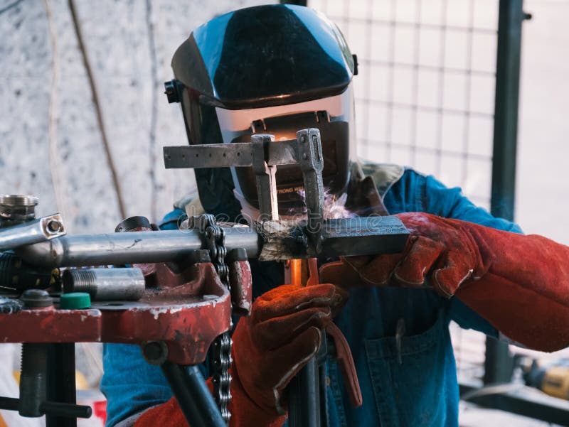 Iron Soldering, Man Working on Iron Soldering, Welding Sparks Stock ...