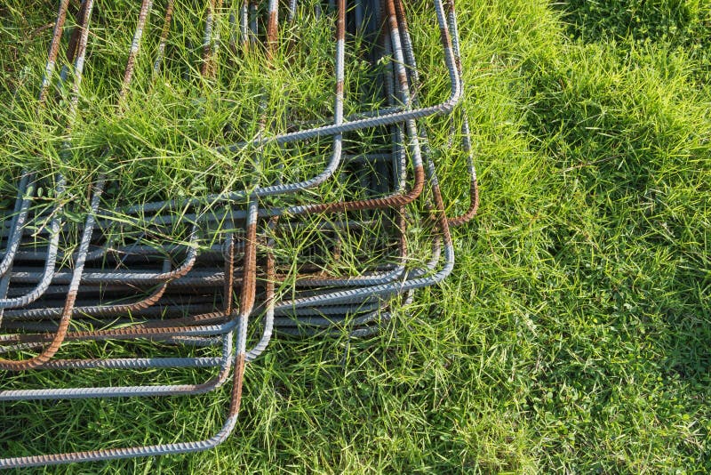 Iron stack on the grass. stock image. Image of rods, pile - 94848047