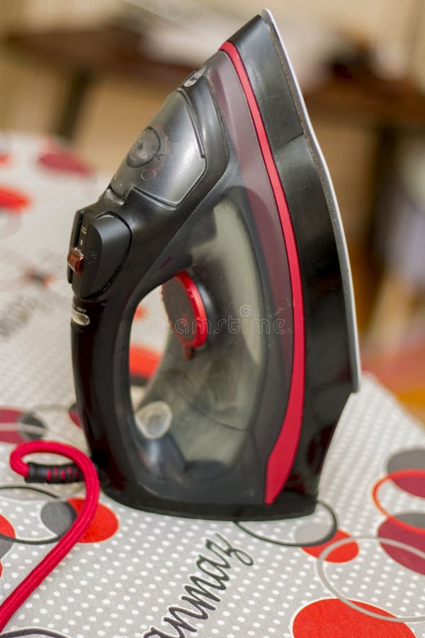Iron Standing on the Ironing Board Closeup Stock Image - Image of iron ...