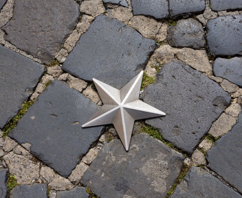 Iron star on the roadway stock photo. Image of iron - 154062696