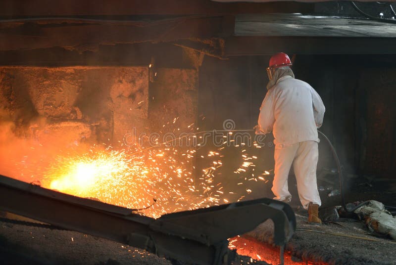 Workers in a Foundry Casting a Metal Workpiece - Safety at Work and ...