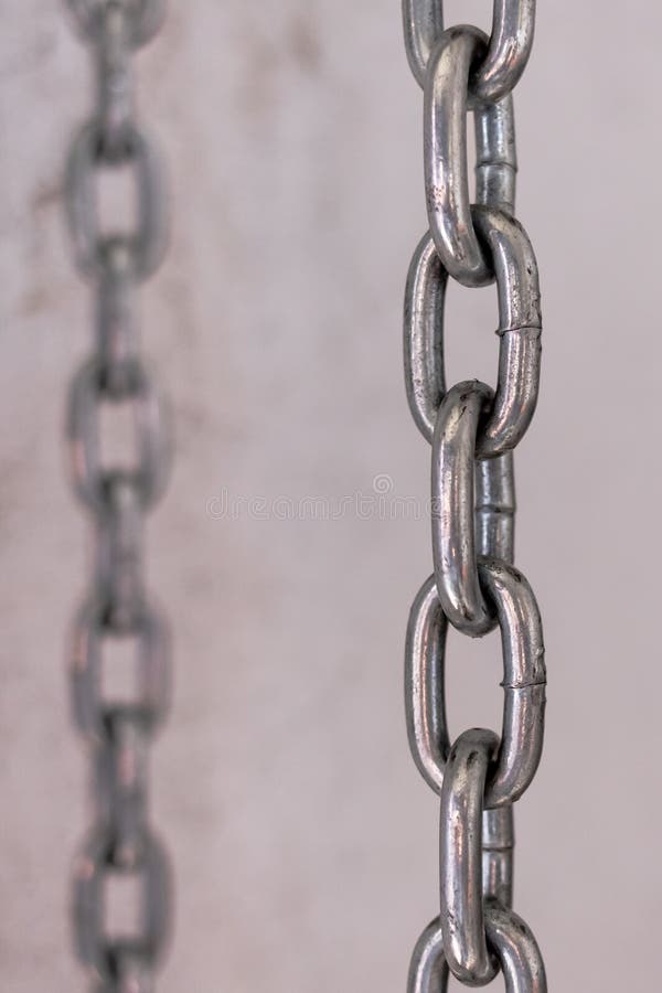 Two Iron Chains Hang Vertically on a Light Background Stock Image ...