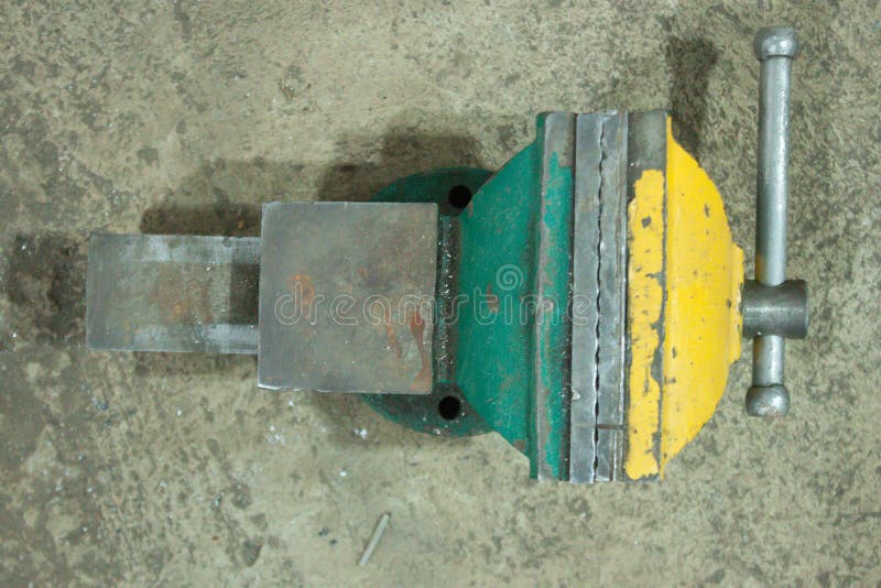 The Iron Vise, Which is Green on the Workshop Floor Stock Photo - Image ...