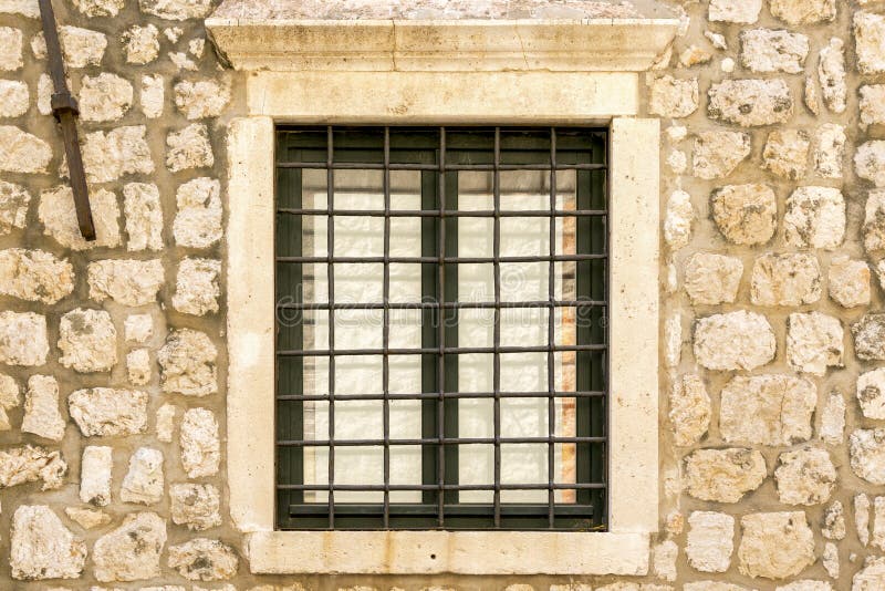 Iron Window on the Facade of a Stone House Stock Image - Image of grill ...