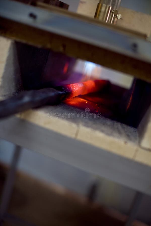 Hot Metal rod in a furnace stock image. Image of artisan - 209944437