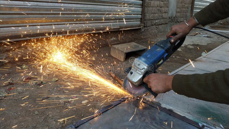 An Iron Worker Doing Grinder Work Stock Image - Image of fire, working ...