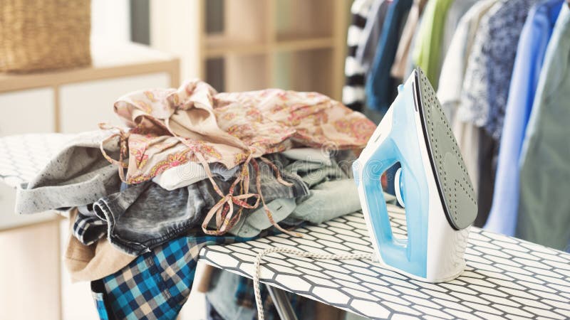 Ironing Clothes on Ironing Board Stock Photo - Image of horizontal ...