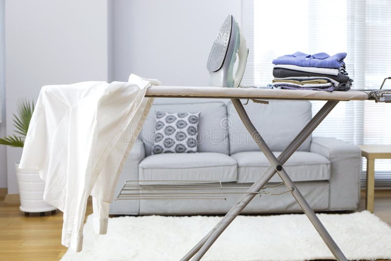 Ironing Clothes on Ironing Board Stock Image - Image of holded, ironing ...