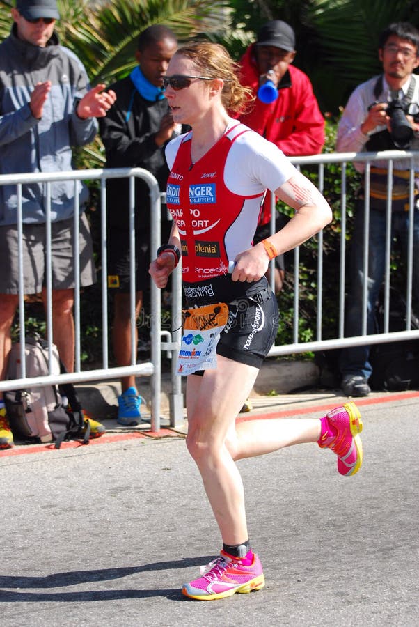 Ironman triathlete running editorial stock photo. Image of area - 24472233