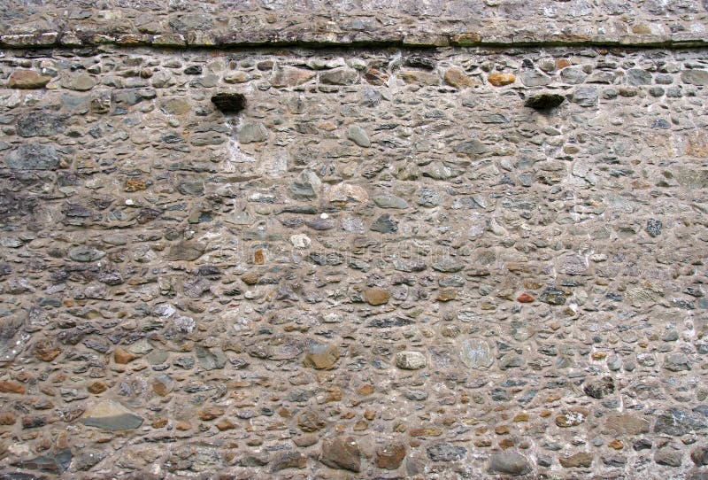 Irregular Brown Rough Stone Wall Background with Cement in between the ...