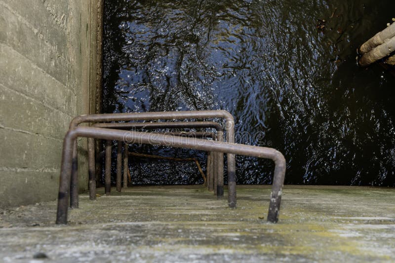 An Irregular Metal Staircase with Bars Embedded in the Concrete of a ...