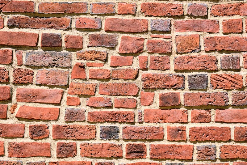 Irregular red brick wall stock image. Image of brick - 154002407