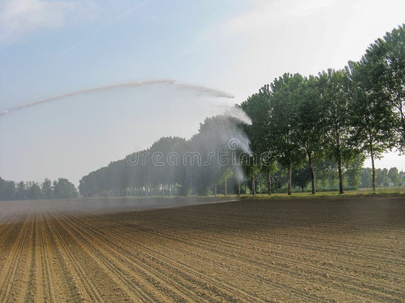 Irrigate the fields stock photo. Image of irrigate, equipment - 124298172