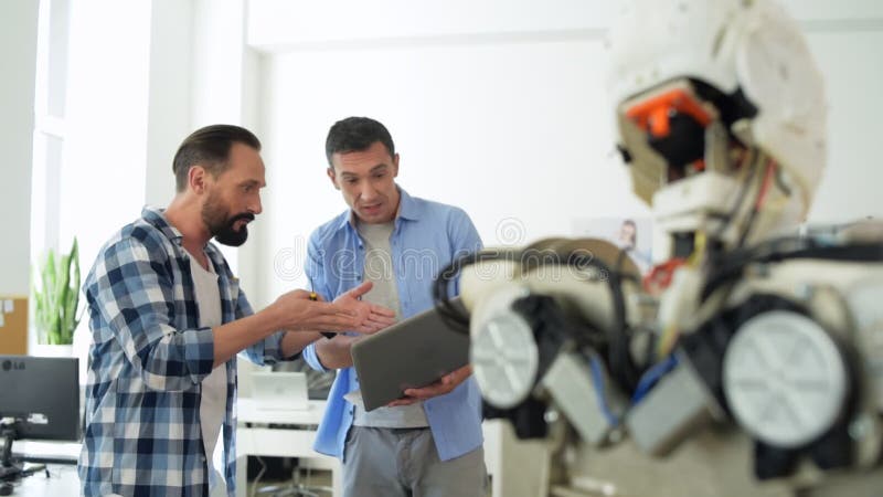 Irritated Engineers Arguing about Robot Construction Stock Footage ...