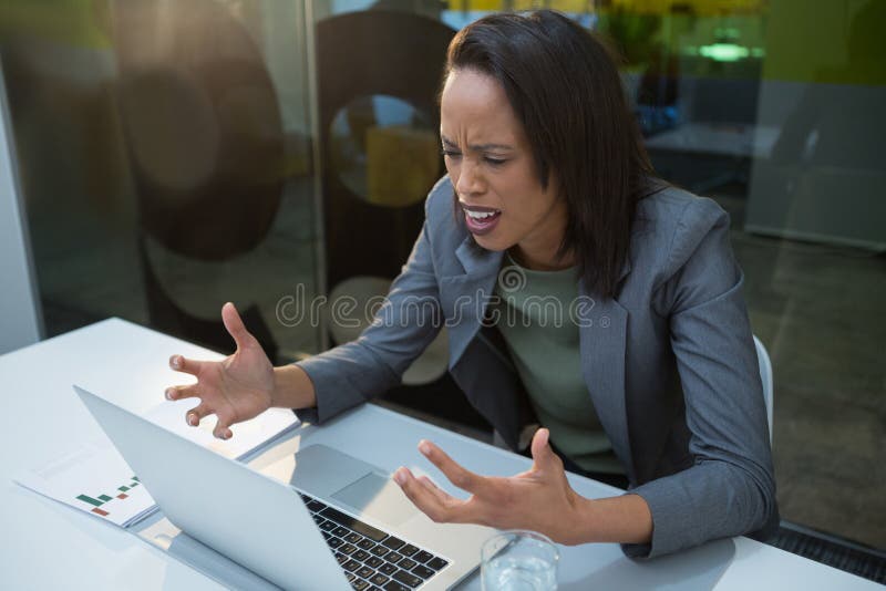Irritated Woman Working at Desk Stock Photo - Image of company ...