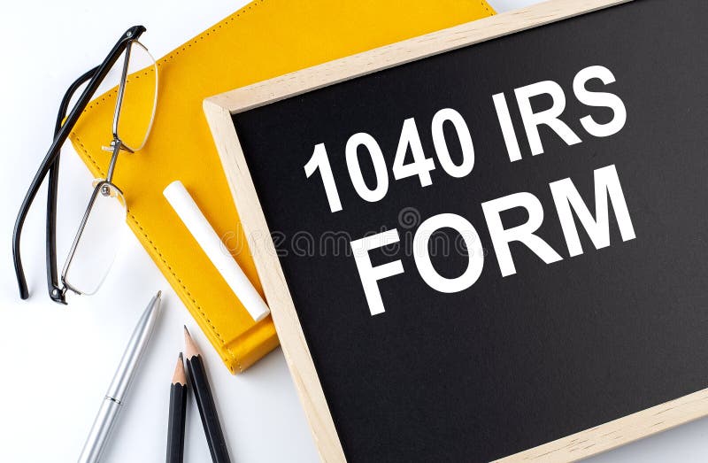 1040 IRS FORM Text on the Blackboard with Notepad , Pen, Pencil Stock ...