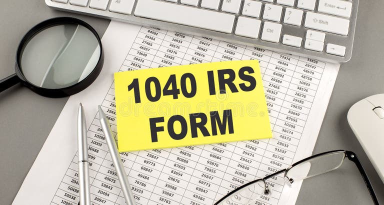 1040 IRS FORM Text Written on a Sticky on Chart with Keyboard and ...