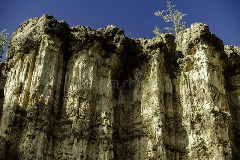 Isimila Sand Pillars Under Bly Sky Stock Photo - Image of plant, cave ...