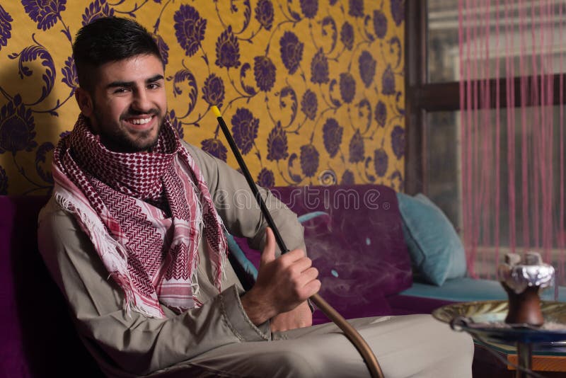 Islamic Man Smoking Shisha In The Arabic Cafe Stock Image Image Of