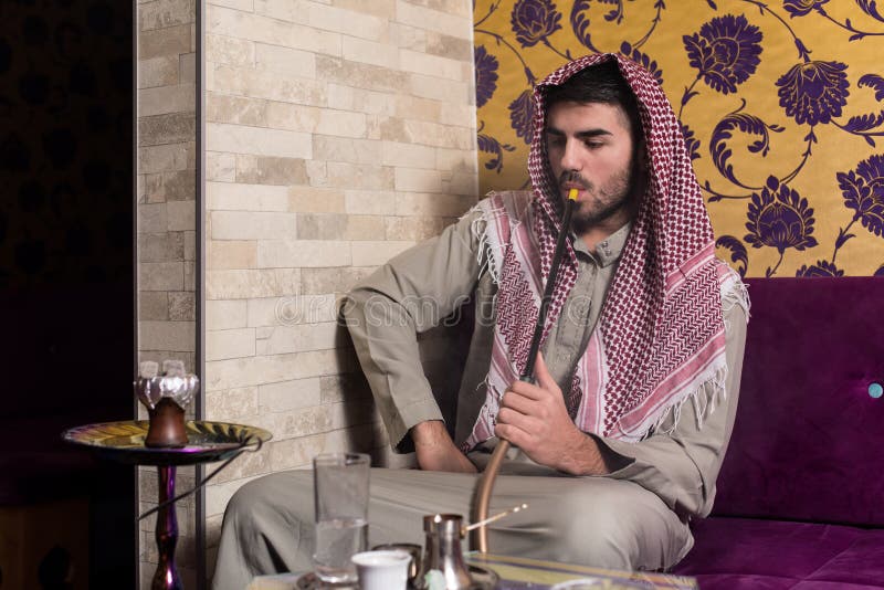 Islamic Man Smoking Shisha In The Arabic Cafe Stock Image Image Of