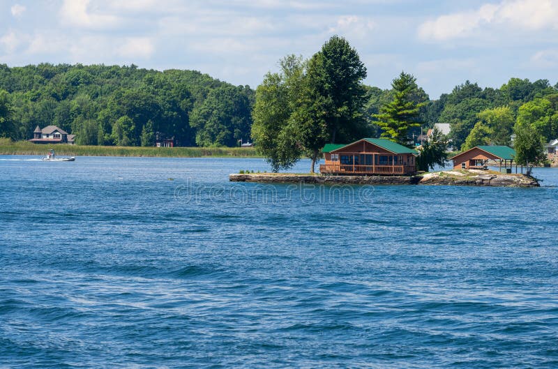 Island with a cottage stock photo. Image of cabin, boat - 83424908