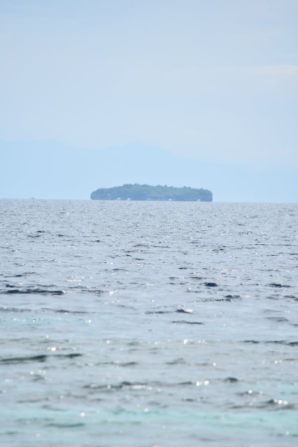 An Island on Horizon in Ocean Stock Image - Image of ocean, scenery ...